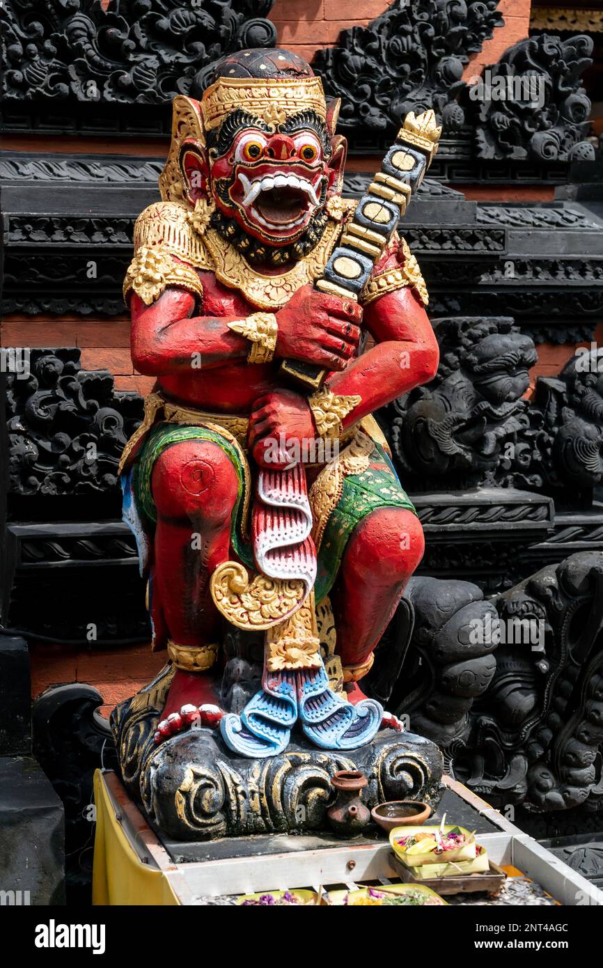 Stone colorful statues at the temple's entrance in Nusa Dua, Bali ...
