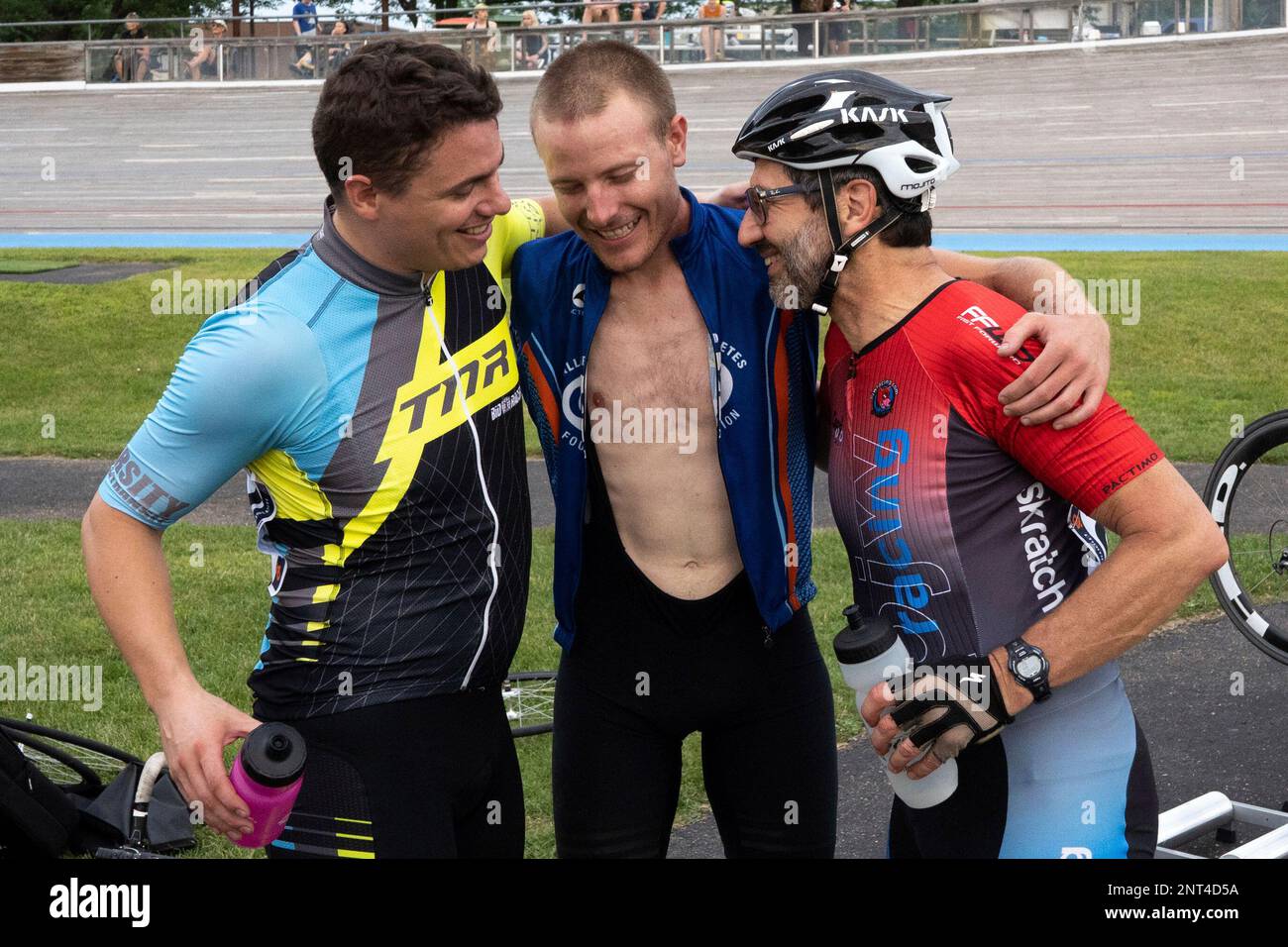 John Terrell, center, hugs Aaron Collins, left, and Mark Stewart after ...