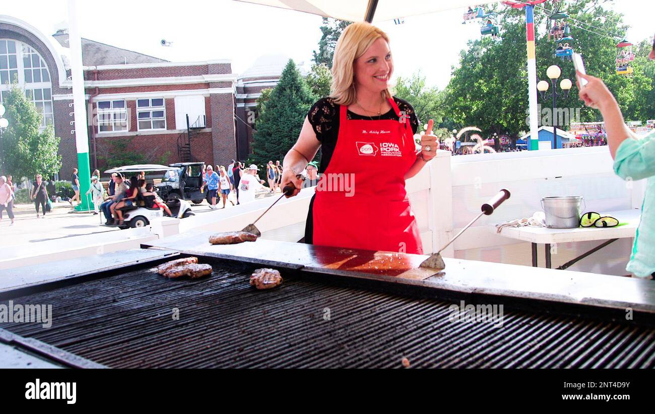 UNITED STATES - AUGUST 15: Iowa State Rep. Ashley Hinson flips pork ...