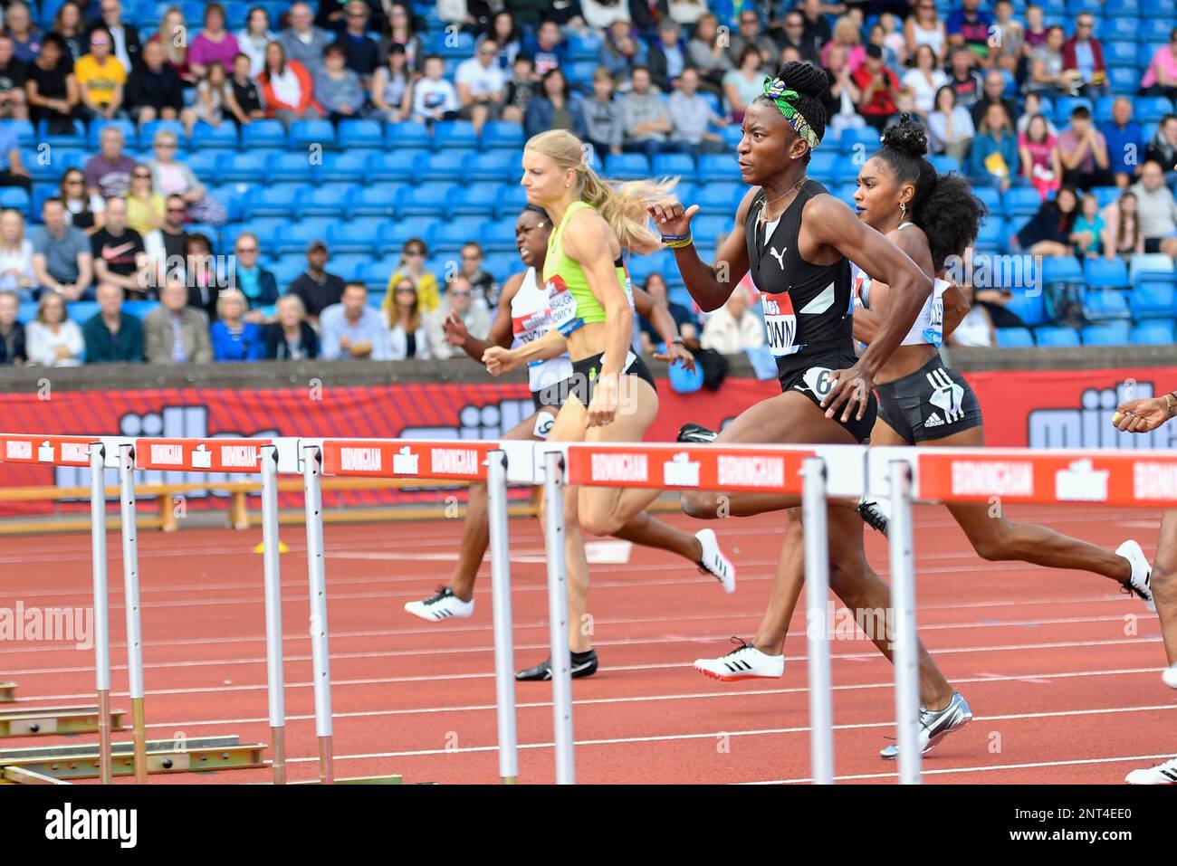 Janeek Brown (JAM) approaches a hurdle during heats of the women's 100m ...