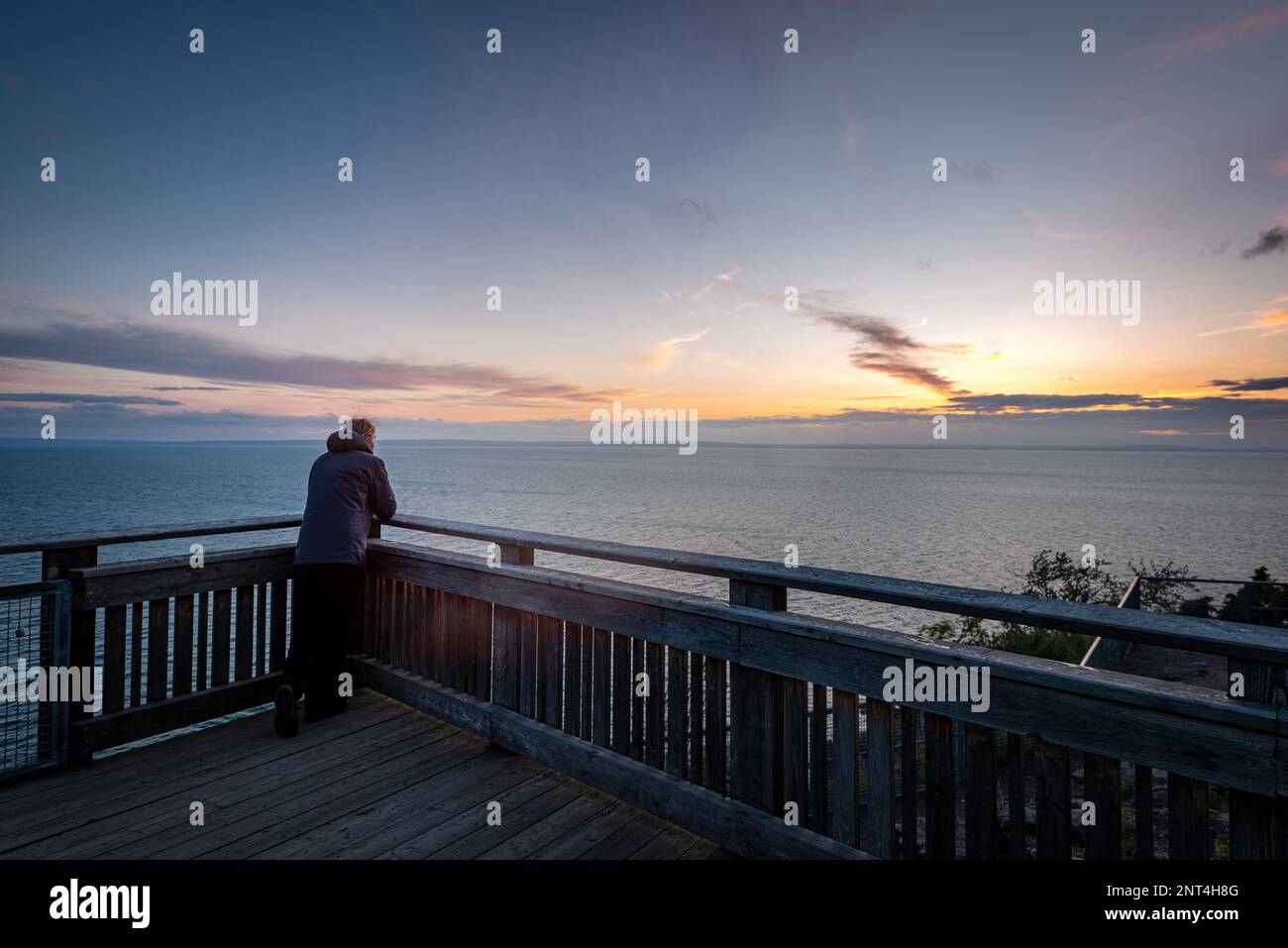 Person standing lake watching hi-res stock photography and images - Alamy