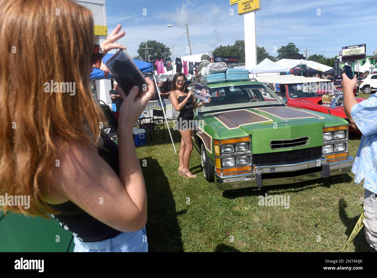 Jessica Van Hoose takes a photo of Daphinne Campodonico at Mel Guthetie ...