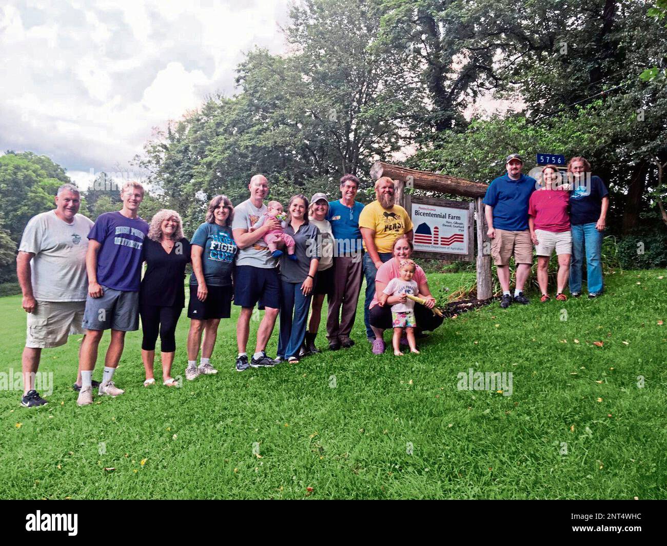 The Gearhard family poses for a photo near their bicentennial farm sign ...