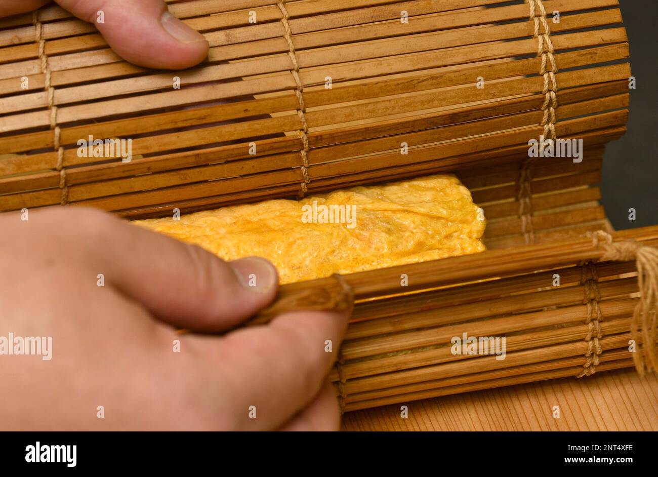 A picture shows the way to make Tamago-yaki, Japanese traditional ...