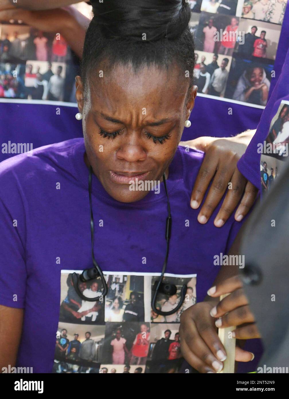 Delisha Searcy, mother of De'Von Bailey, is comforted at a news ...