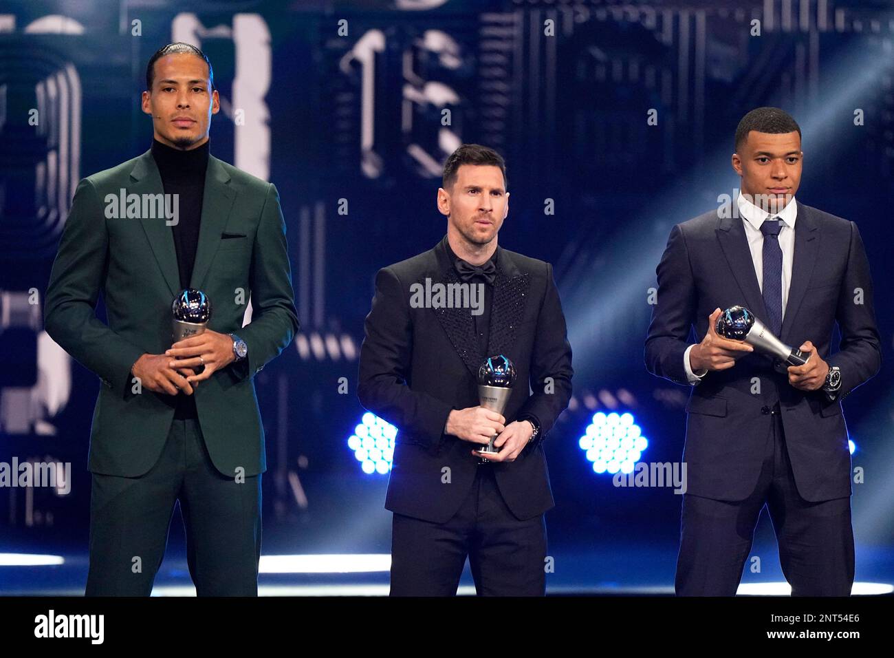 Virgil van Dijk, left, Lionel Messi, center, and Kylian Mbappe pose with trophies Men's World 11 ...