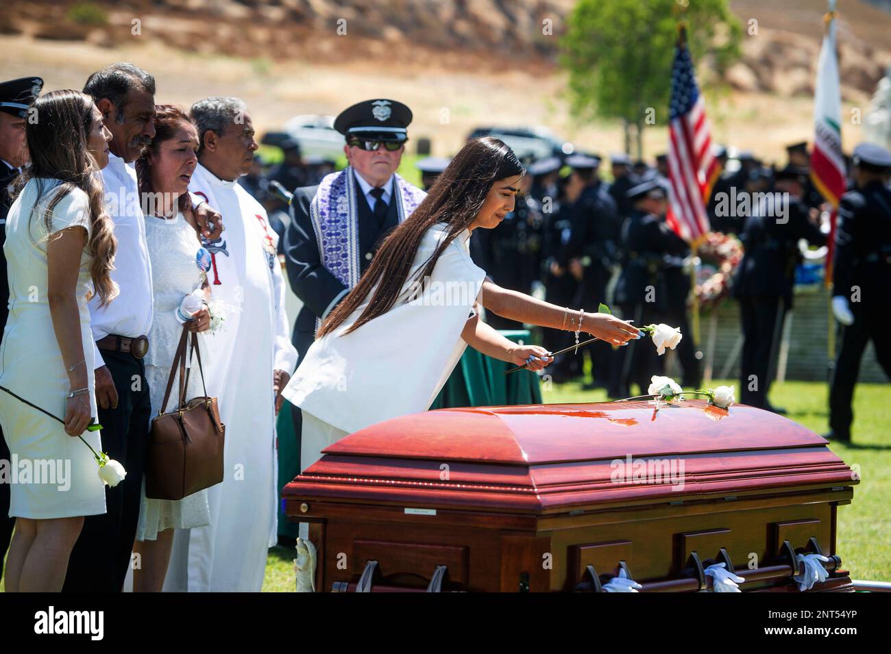 Anahi Diaz places a flower on her brother Los Angeles Police Department ...
