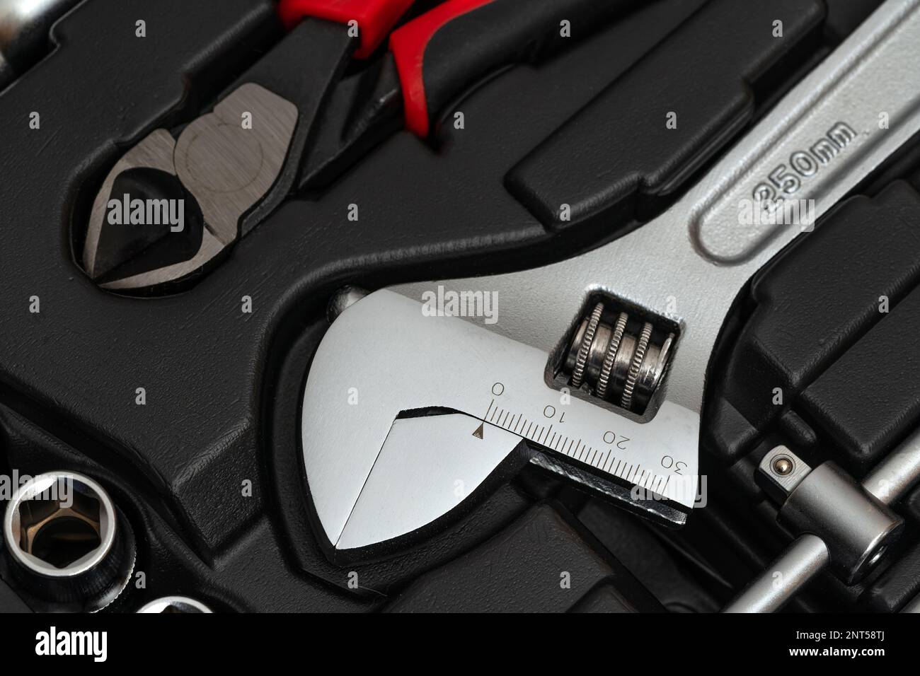 Adjustable wrench in the toolbox. Close up Stock Photo - Alamy