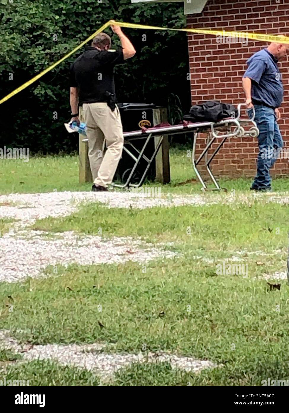 Officials work the scene of a fatal shooting at West Ripley Church of ...
