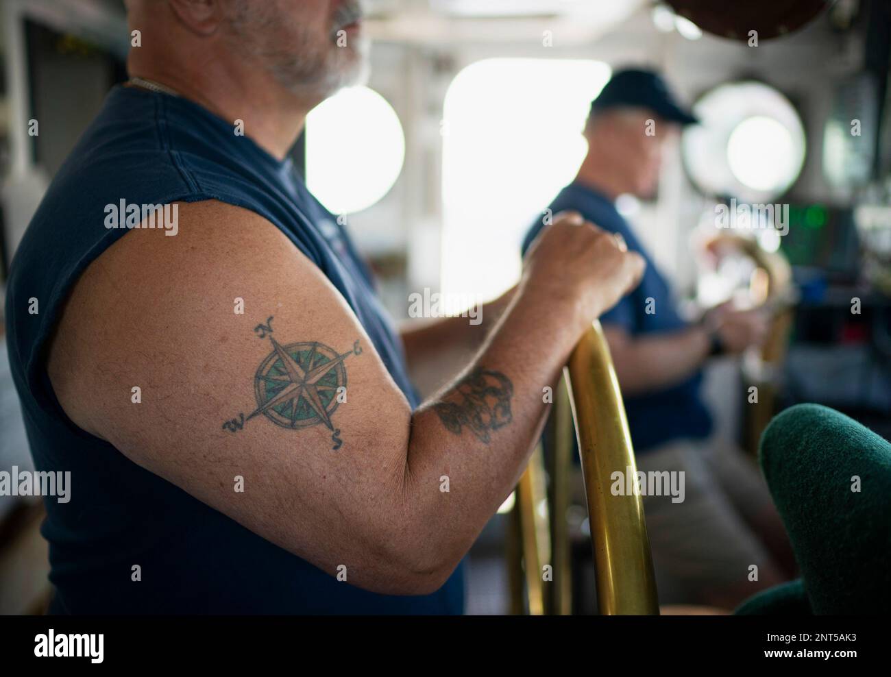 Steve Kelley pilots the U.S. Coast Guard Cutter Sundew towards the Lift ...