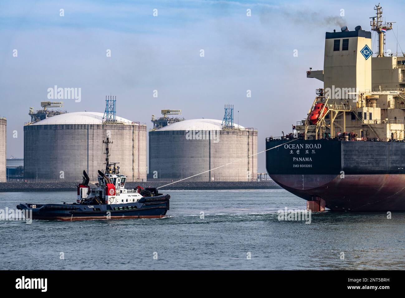 LNG import terminal Tanks for liquid natural gas in the seaport of Rotterdam, harbour tug ...