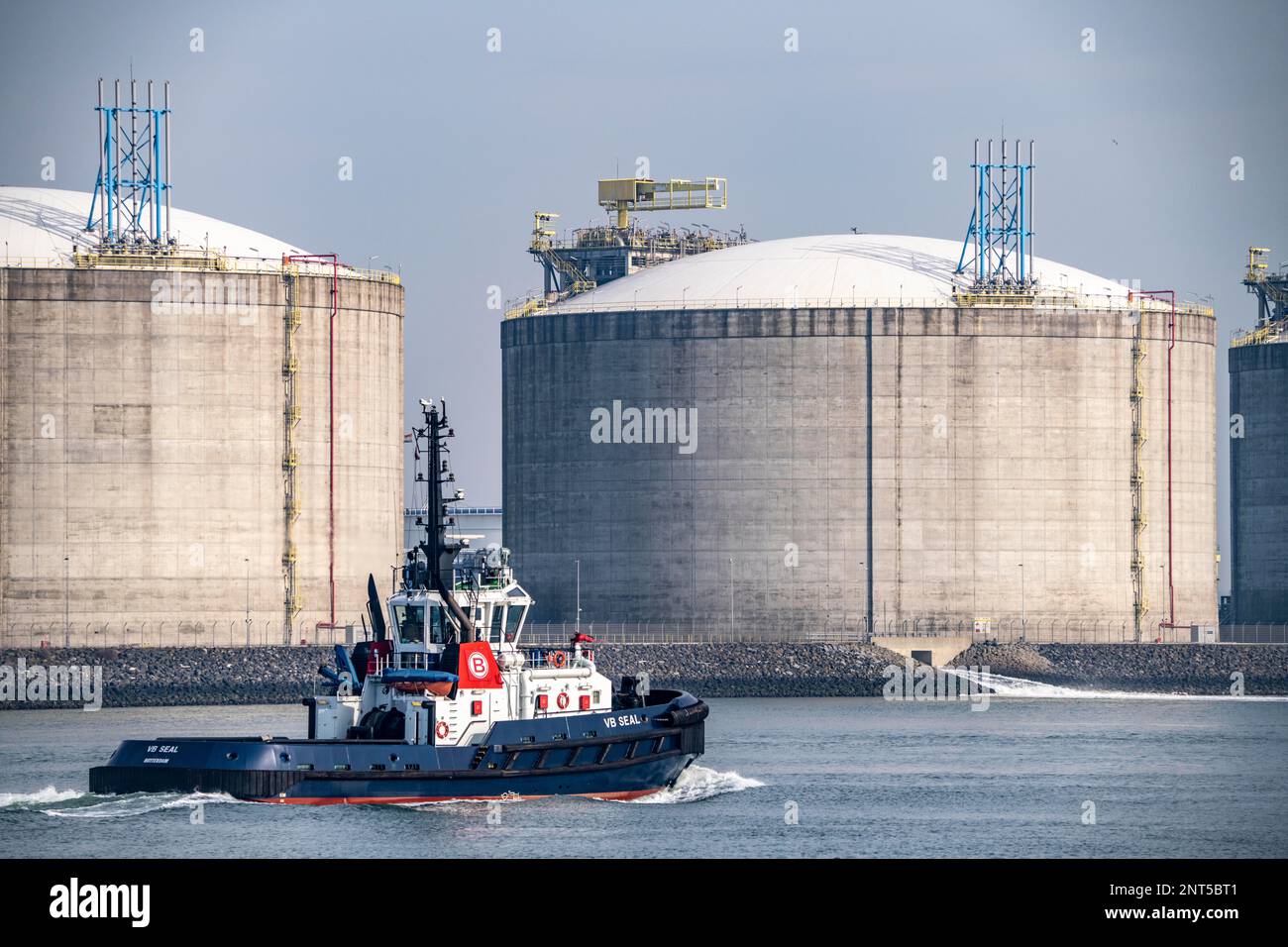 LNG import terminal Tanks for liquid natural gas in the seaport of Rotterdam, harbour tug ...