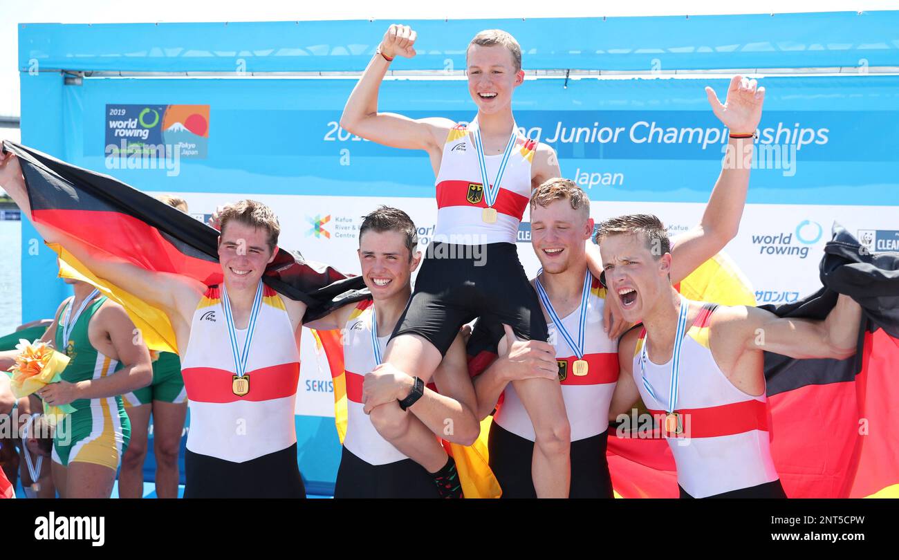 Germany team members celebrate on the podium after winning the (JM4 ...