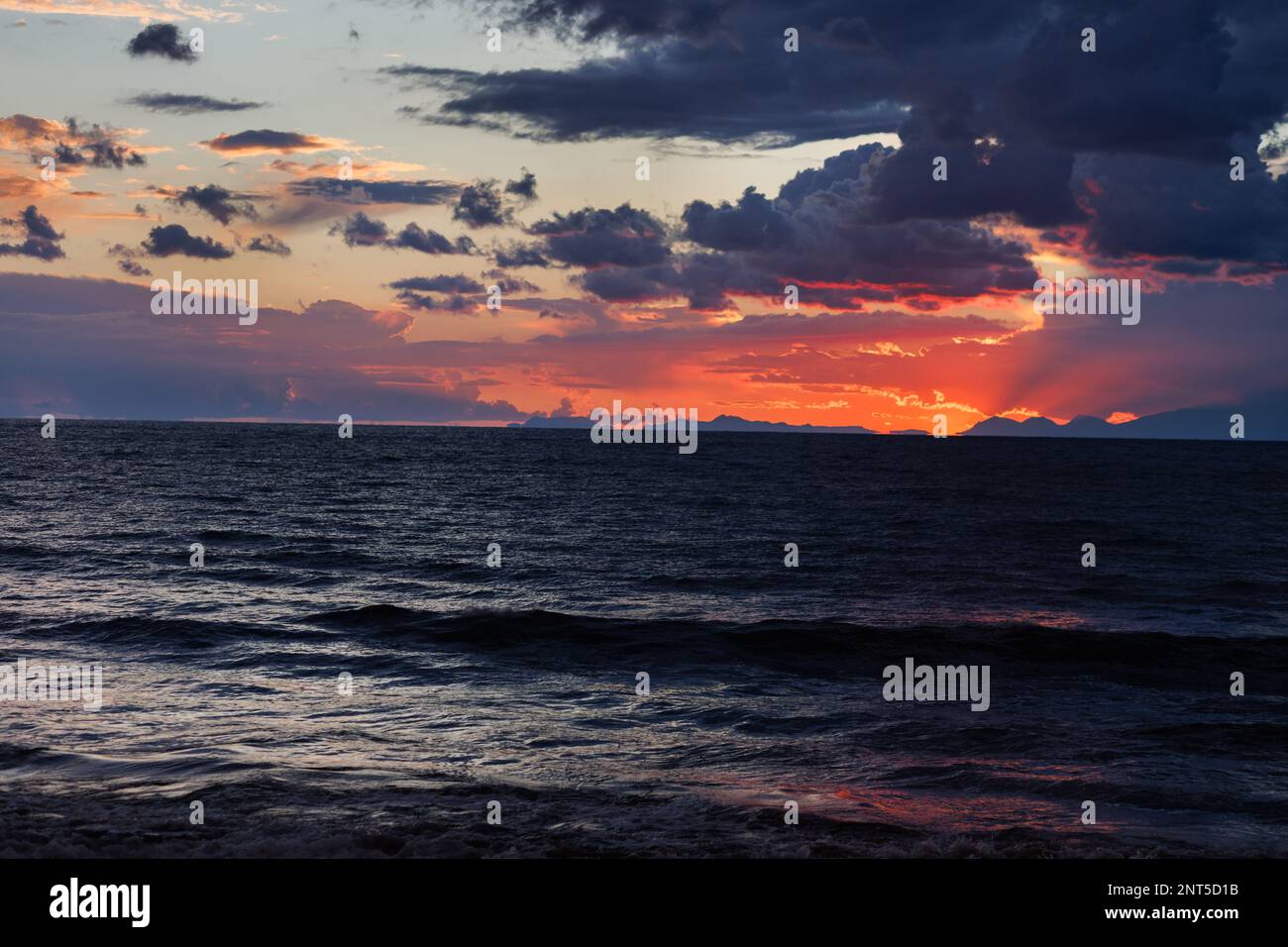 Colorful ocean beach sunrise Stock Photo - Alamy
