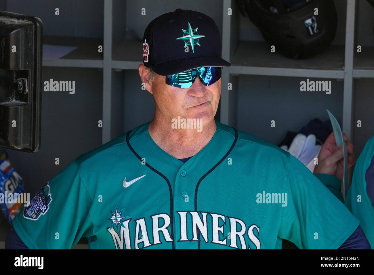 Seattle Mariners manager Scott Servais pauses in the dugout prior to a ...