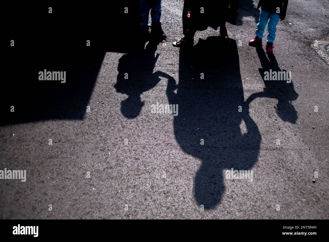 King Clark, 3 at left, and his sister Sanaa Clark, 2, walk hand-in-hand ...
