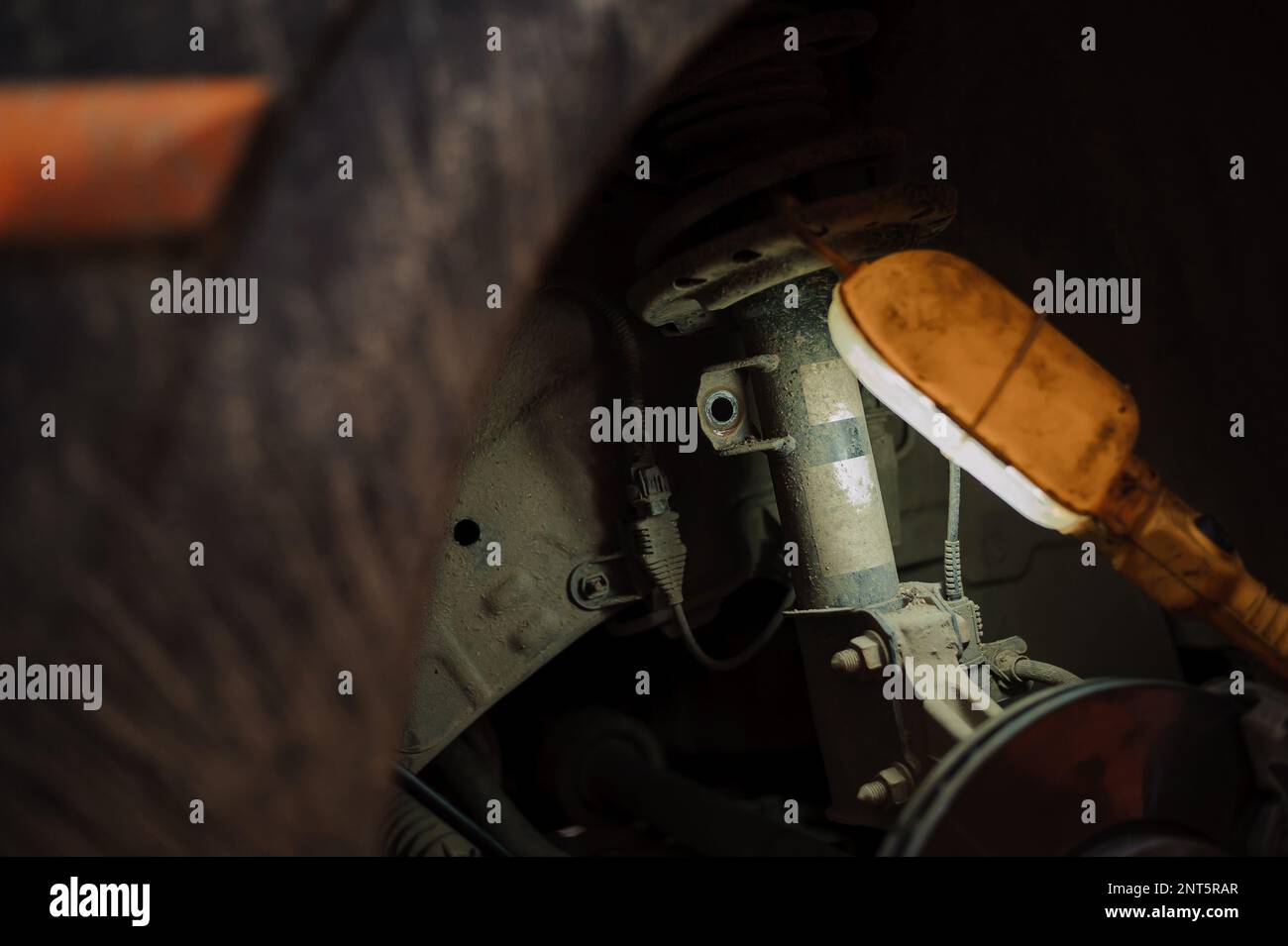 Replacement and repair of wheels and shock absorbers on a car Stock ...