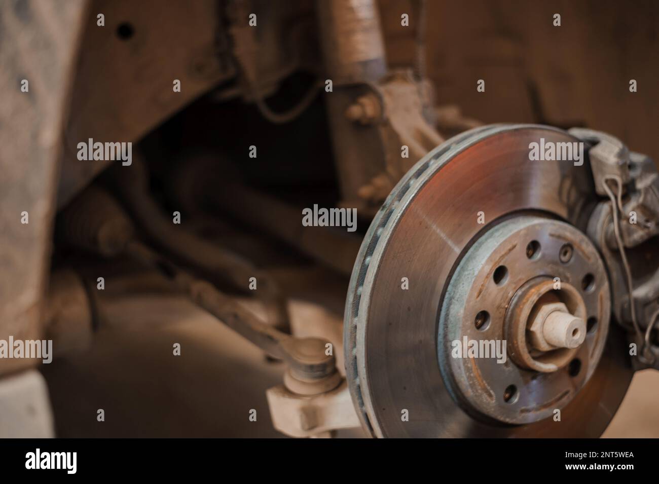 Car brake part in the garage, car brake disc without wheels. Current ...