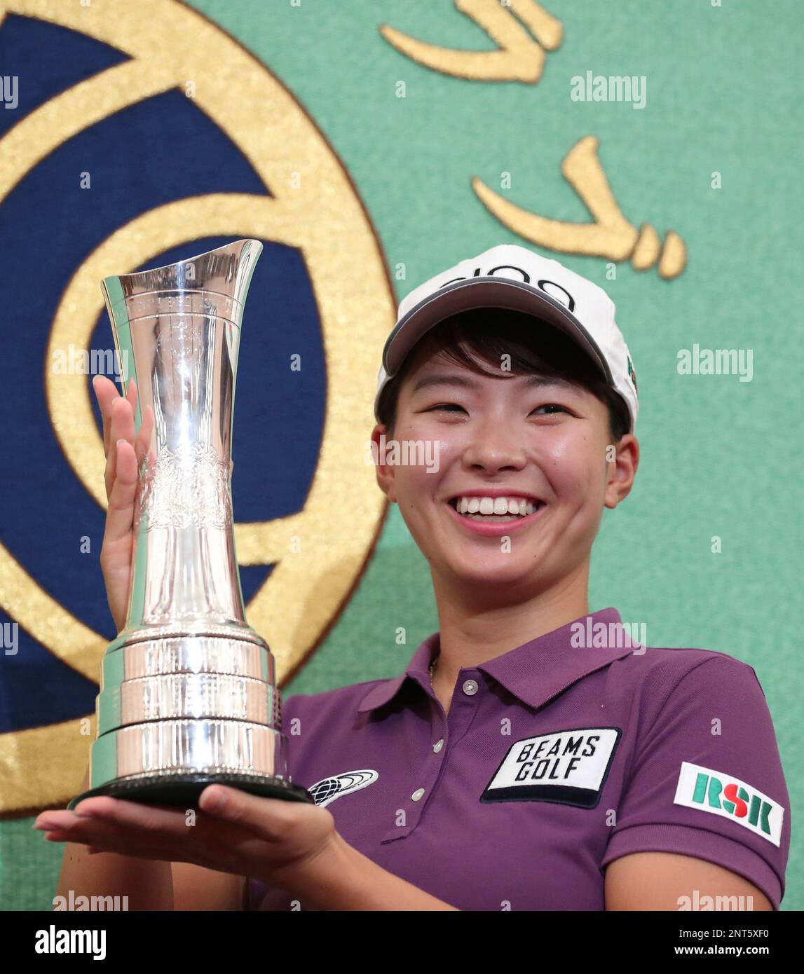Japanese pro golfer Hinako Shibuno poses with a trophy during a news ...