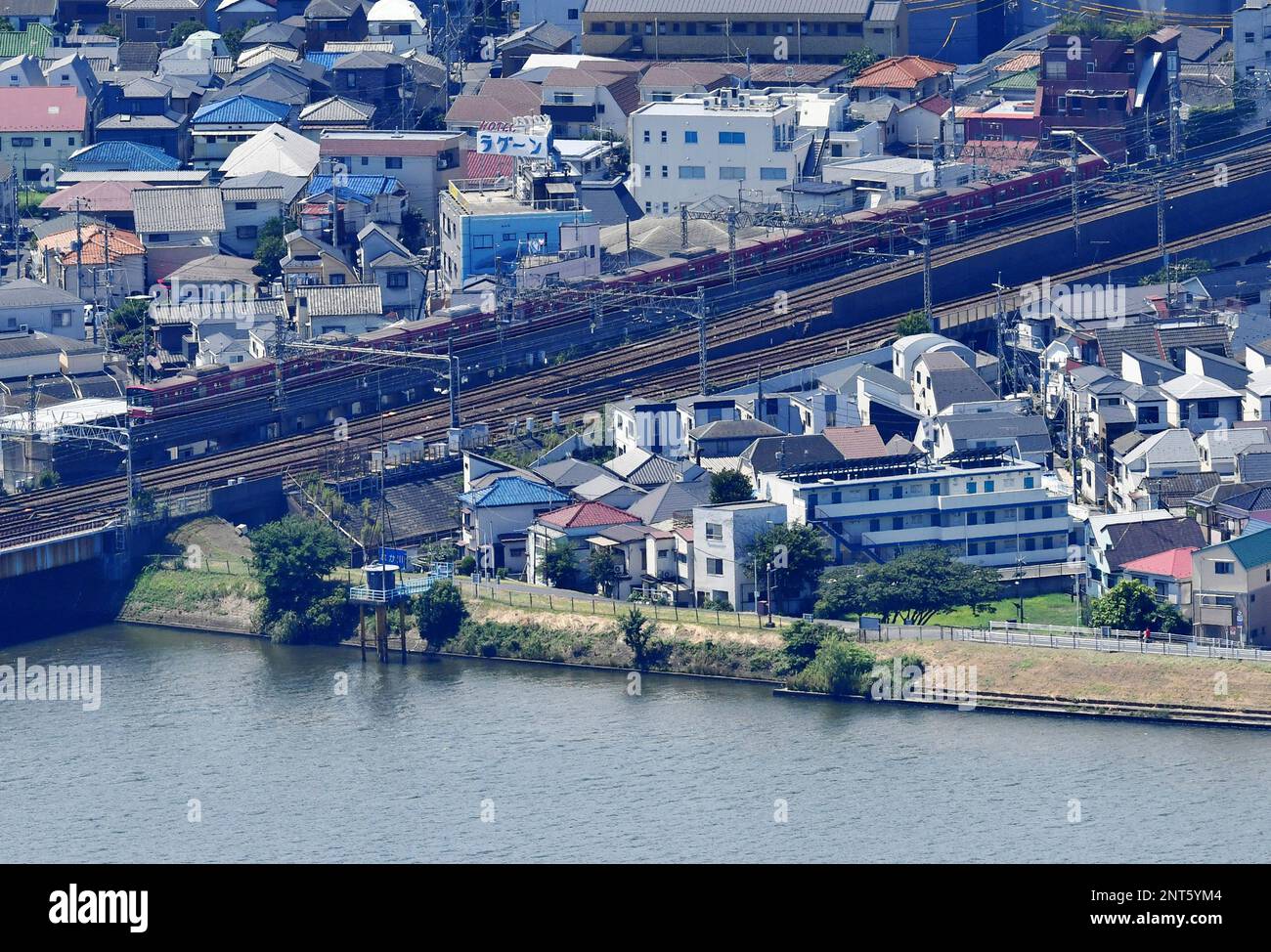 An aerial photo shows a Keisei Electric Railway train car stopped by a ...