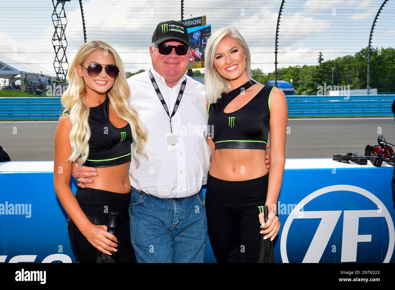 Team owner Chip Ganassi poses with Monster Grils during pre-race ...