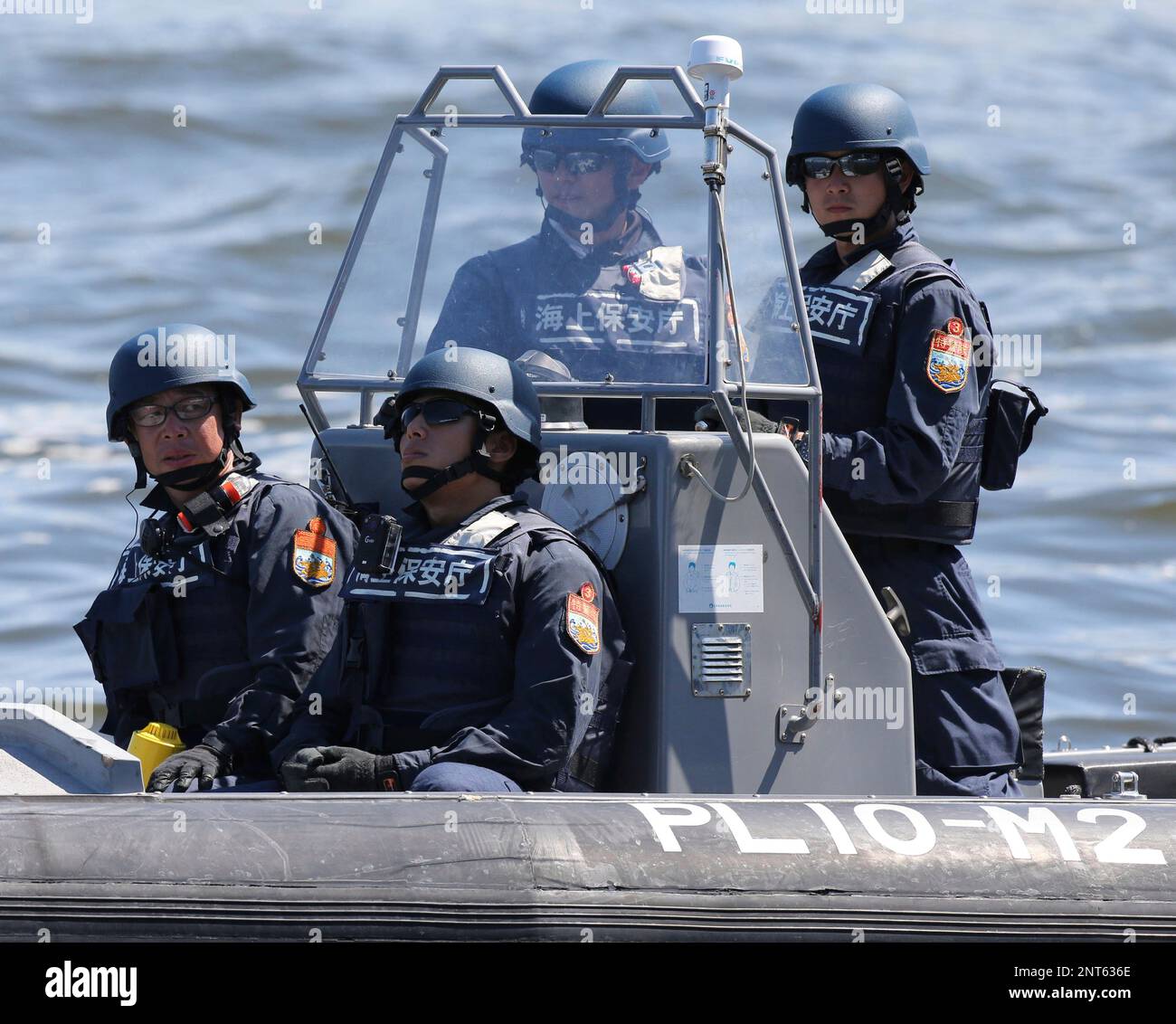Members of Japan's Maritime Self Defense Force and Coast Guard stage a ...