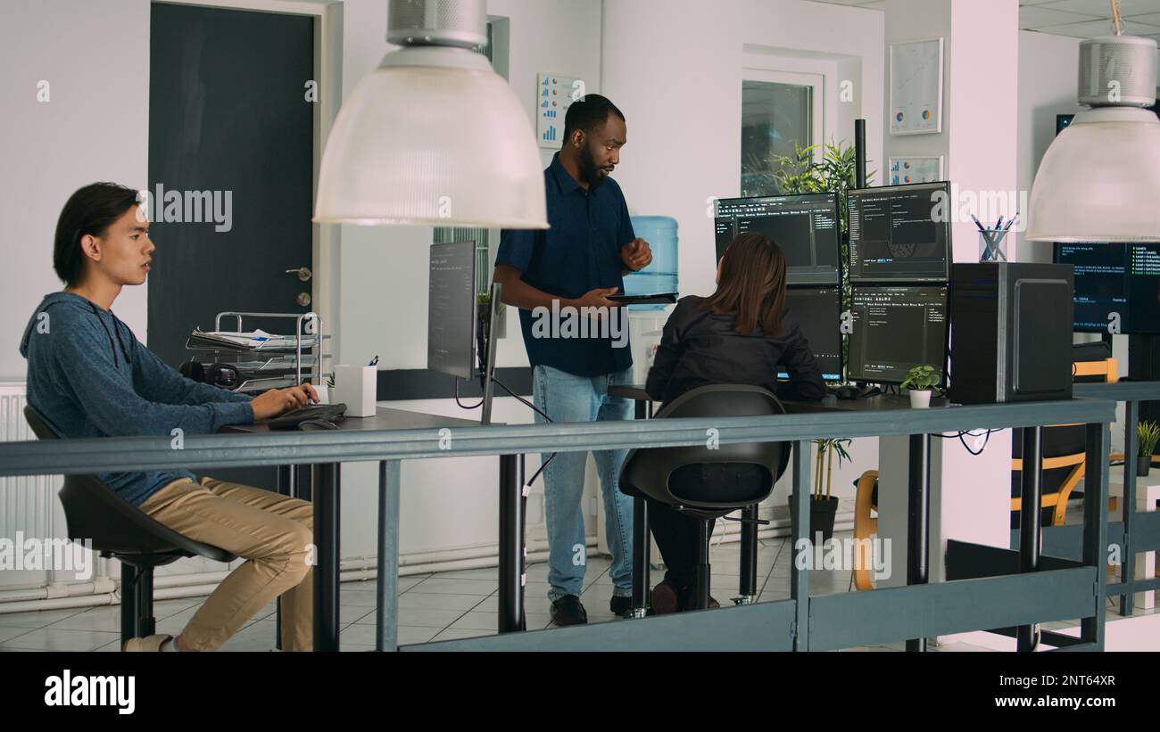 Multiethnic Team Of App Developers Collaborating On Group Project Algorithm For New Cloud