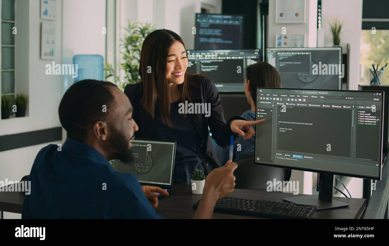 Team of diverse programers doing highfive gesture after coding database, celebrating cloud ...