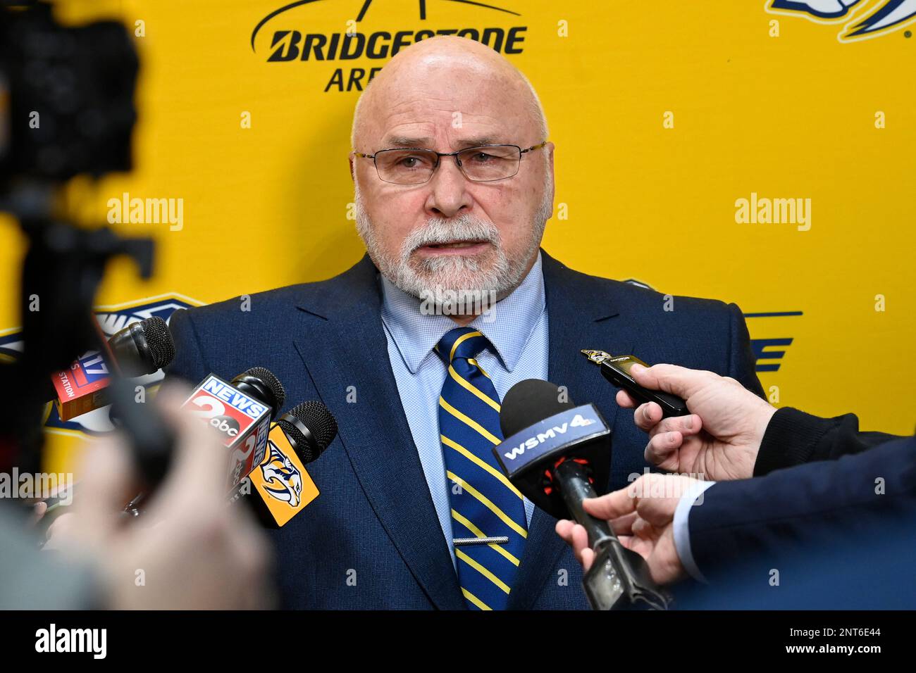 Former Nashville Predators head coach Barry Trotz speaks with members ...
