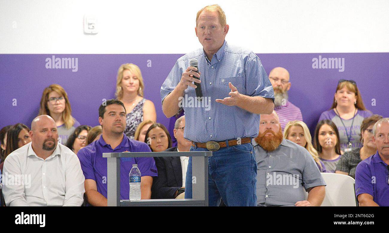 Brian Hall, with Hall Brothers Construction, speaks during a ribbon ...