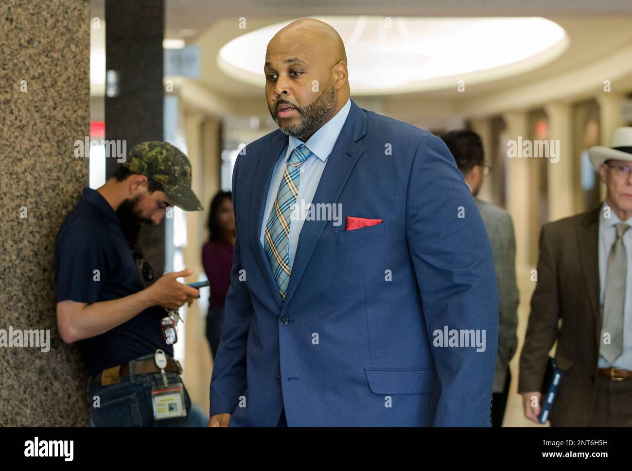 Former Harris County Sheriff's Office Deputy Cameron Brewer walks into ...