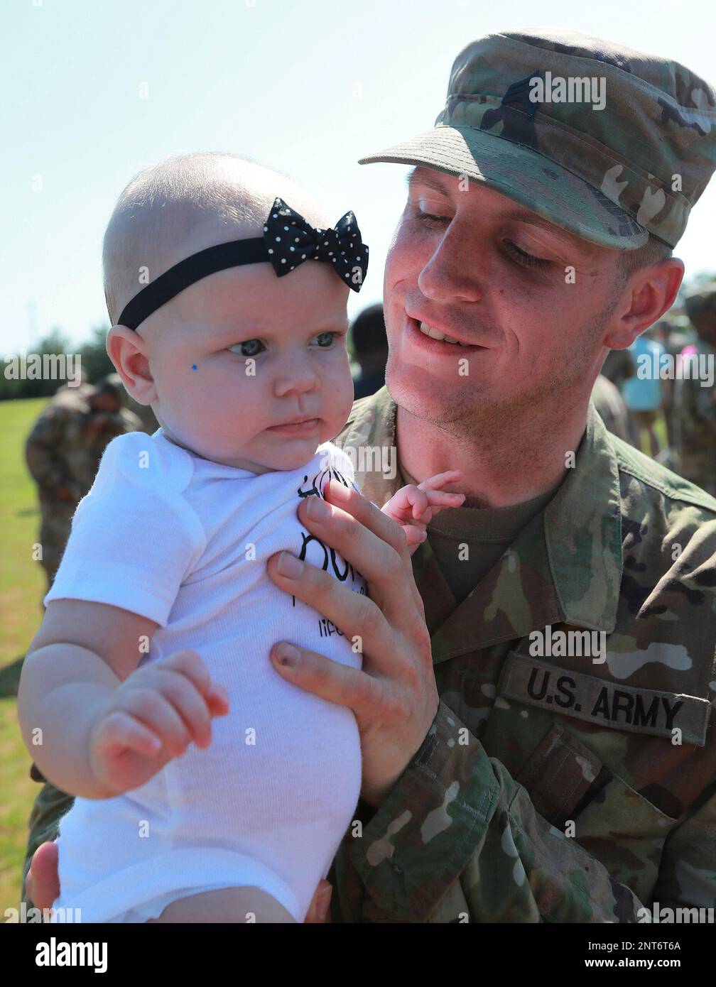 Sergeant Jason Calahan, Savannah, reacts to seeing his 4-month old ...