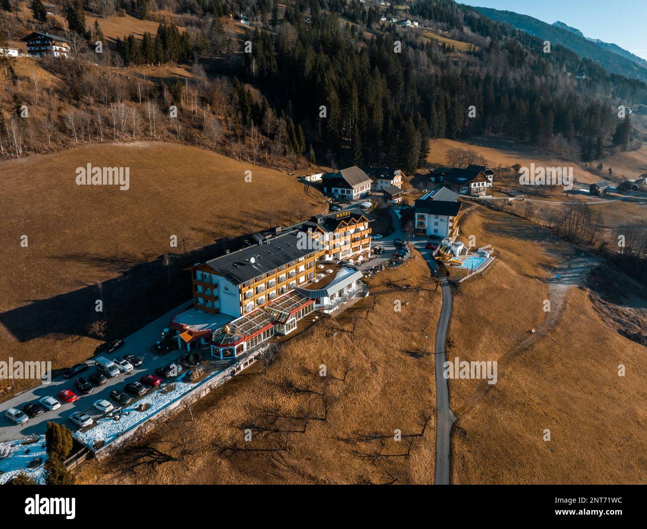 Beautiful luxury Alpine hotel on top of the mountain during spring time ...