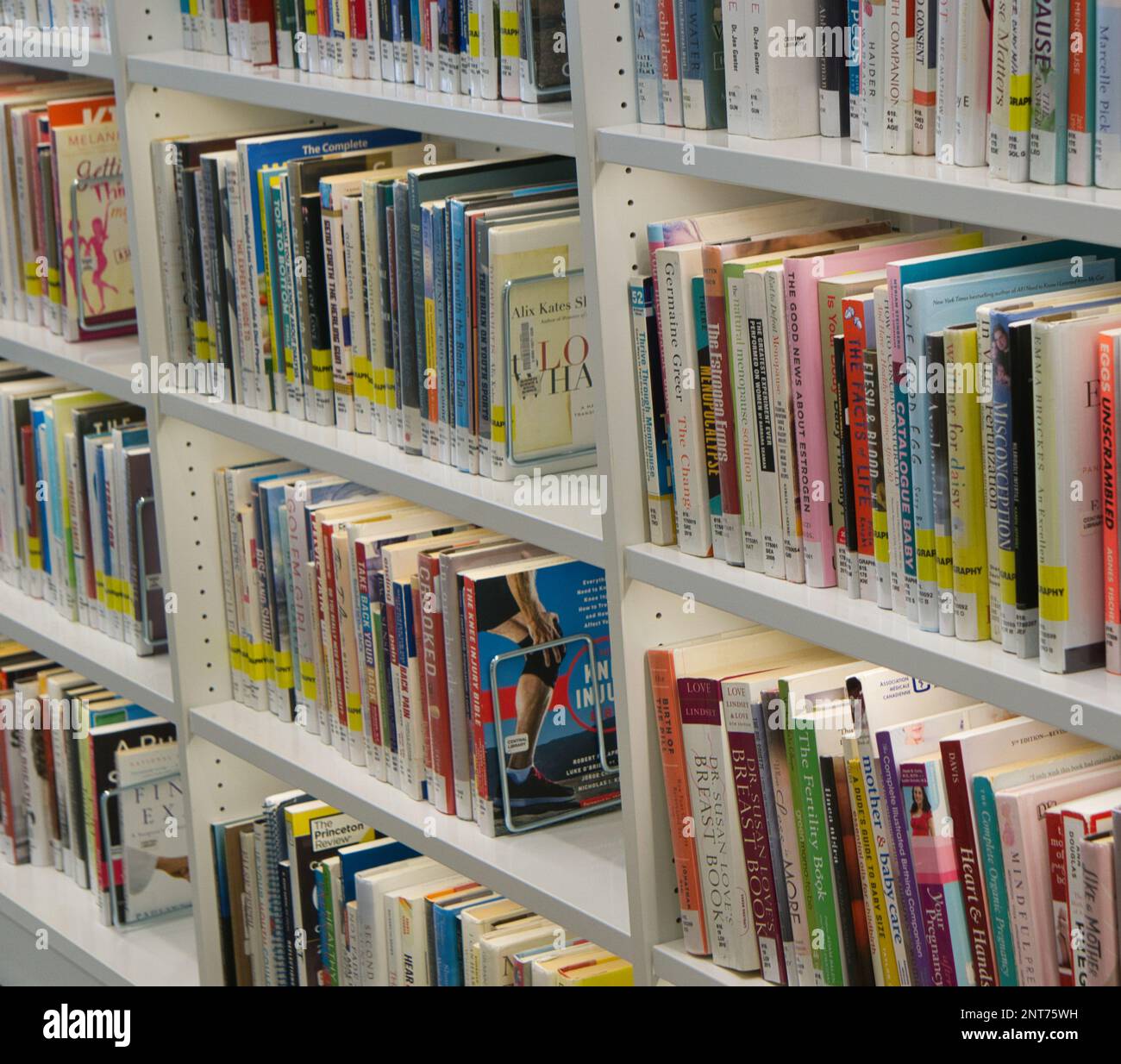 a book shelf filled with books Stock Photo - Alamy