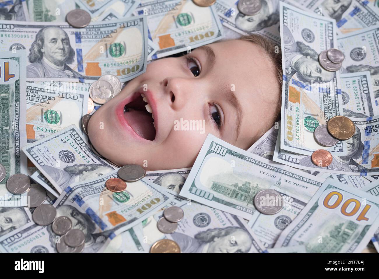 Funny child face in money dollars banknotes background. Money banknotes ...