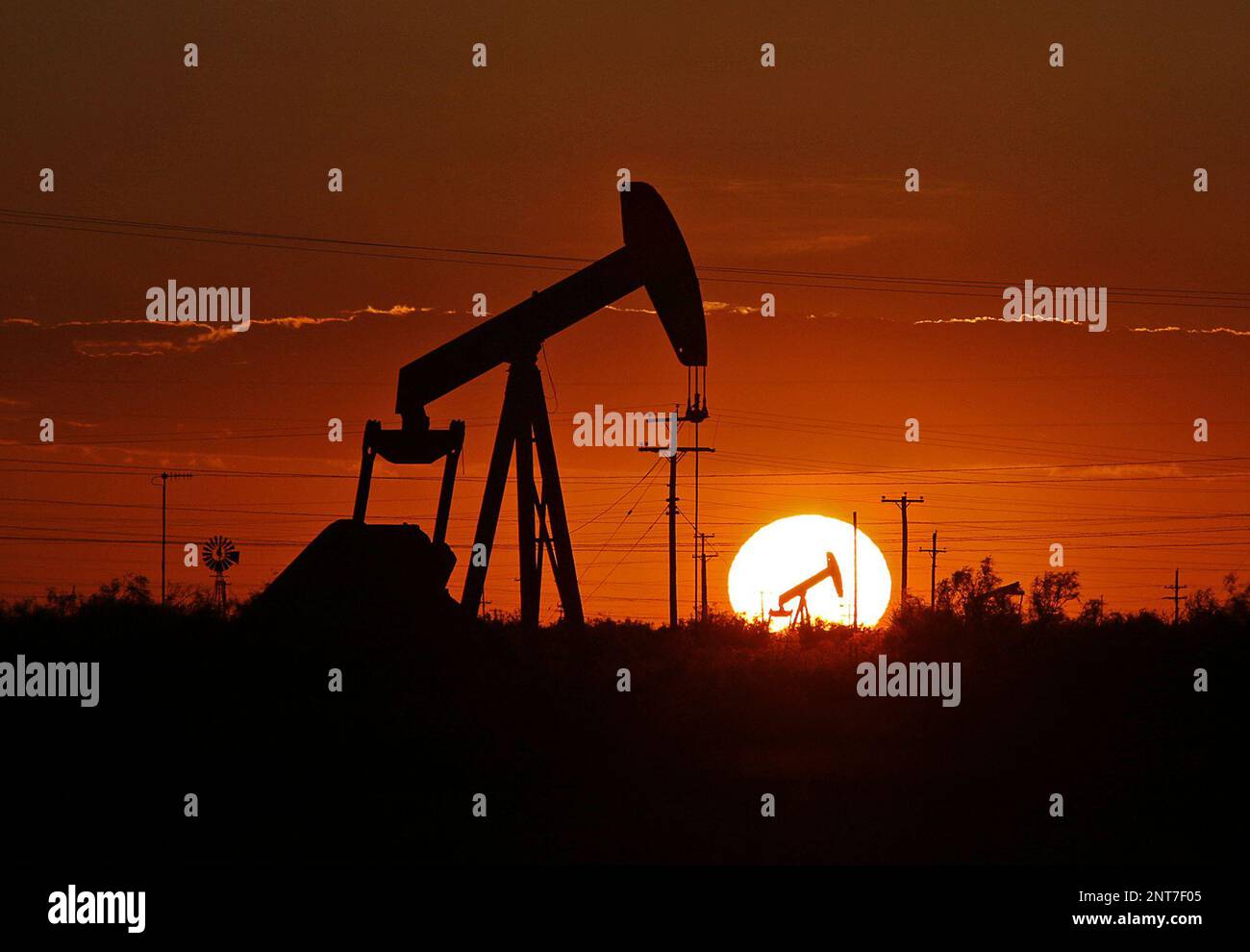 FILE - In this June 11, 2019, file photo a pump jack operates in an oil ...