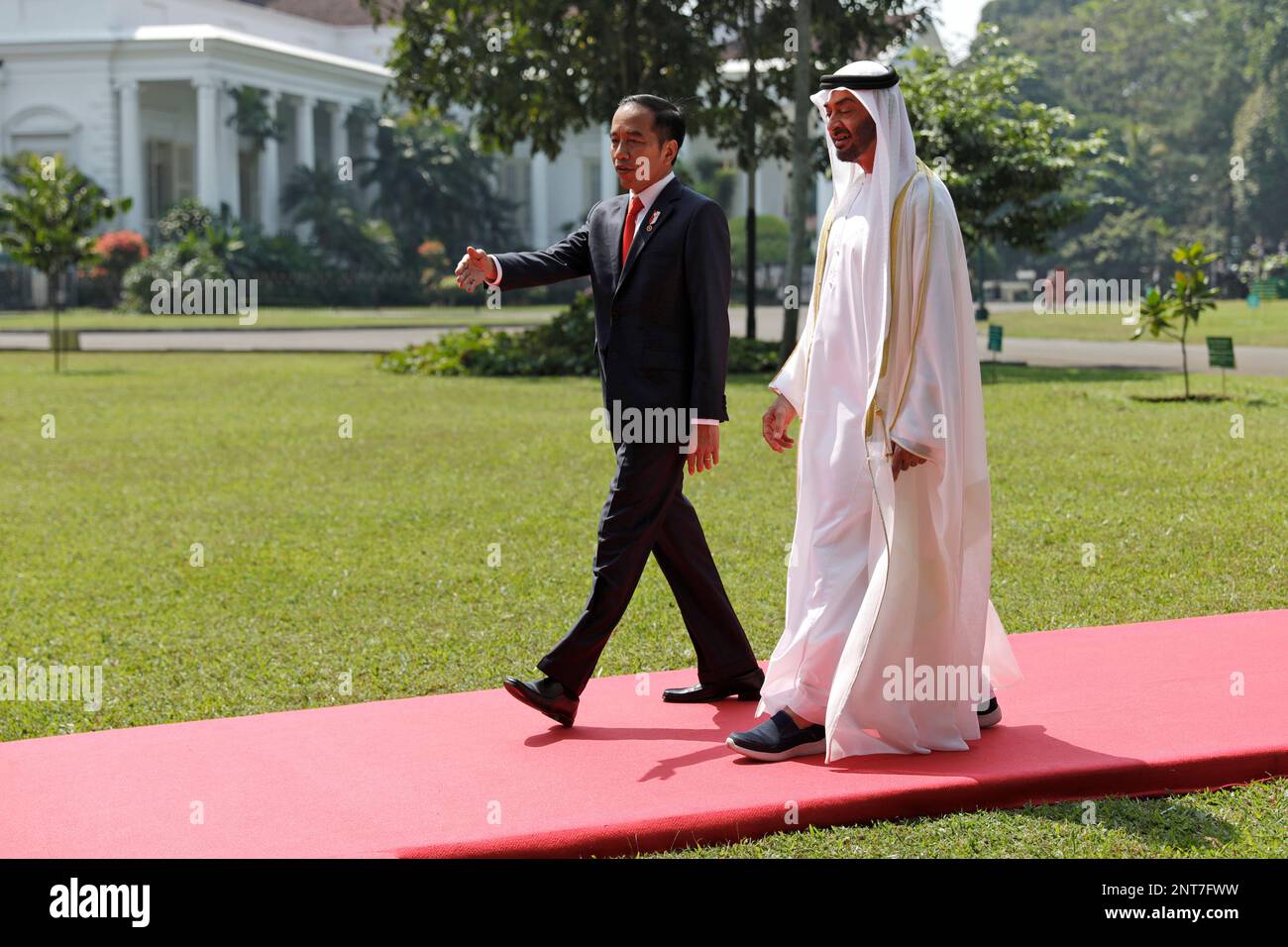 Indonesian President Joko Widodo, left, shows the way to Abu Dhabi's ...
