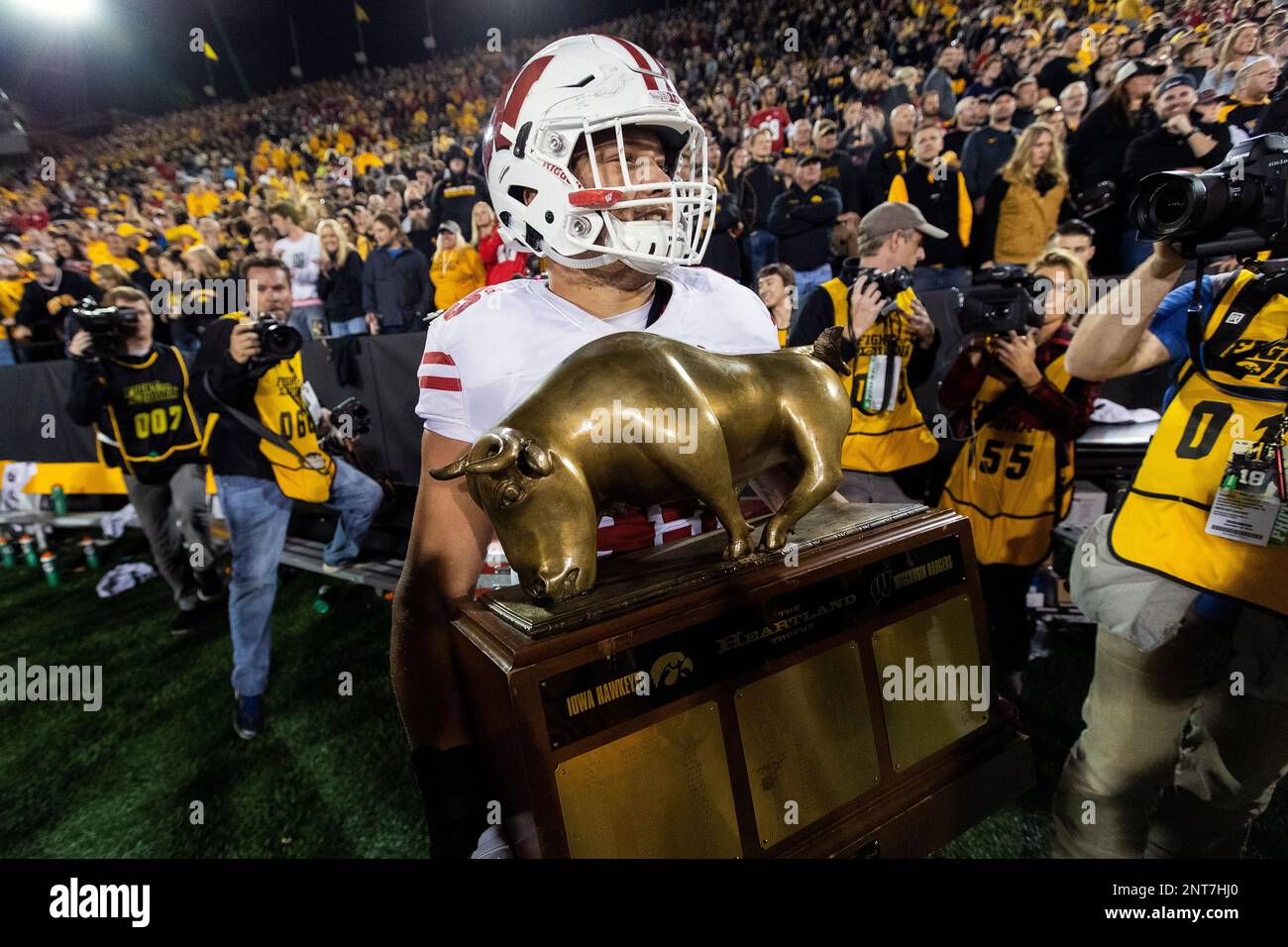 Wisconsin Badgers Alec Ingold (45) carries the Heartland Trophy after ...