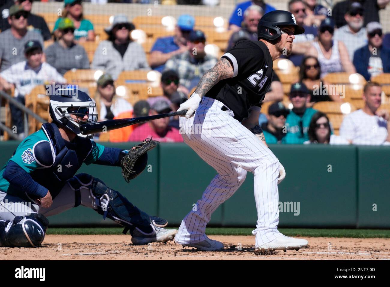 Chicago White Sox's Yasmani Grandal (24) watches the flight of his ...