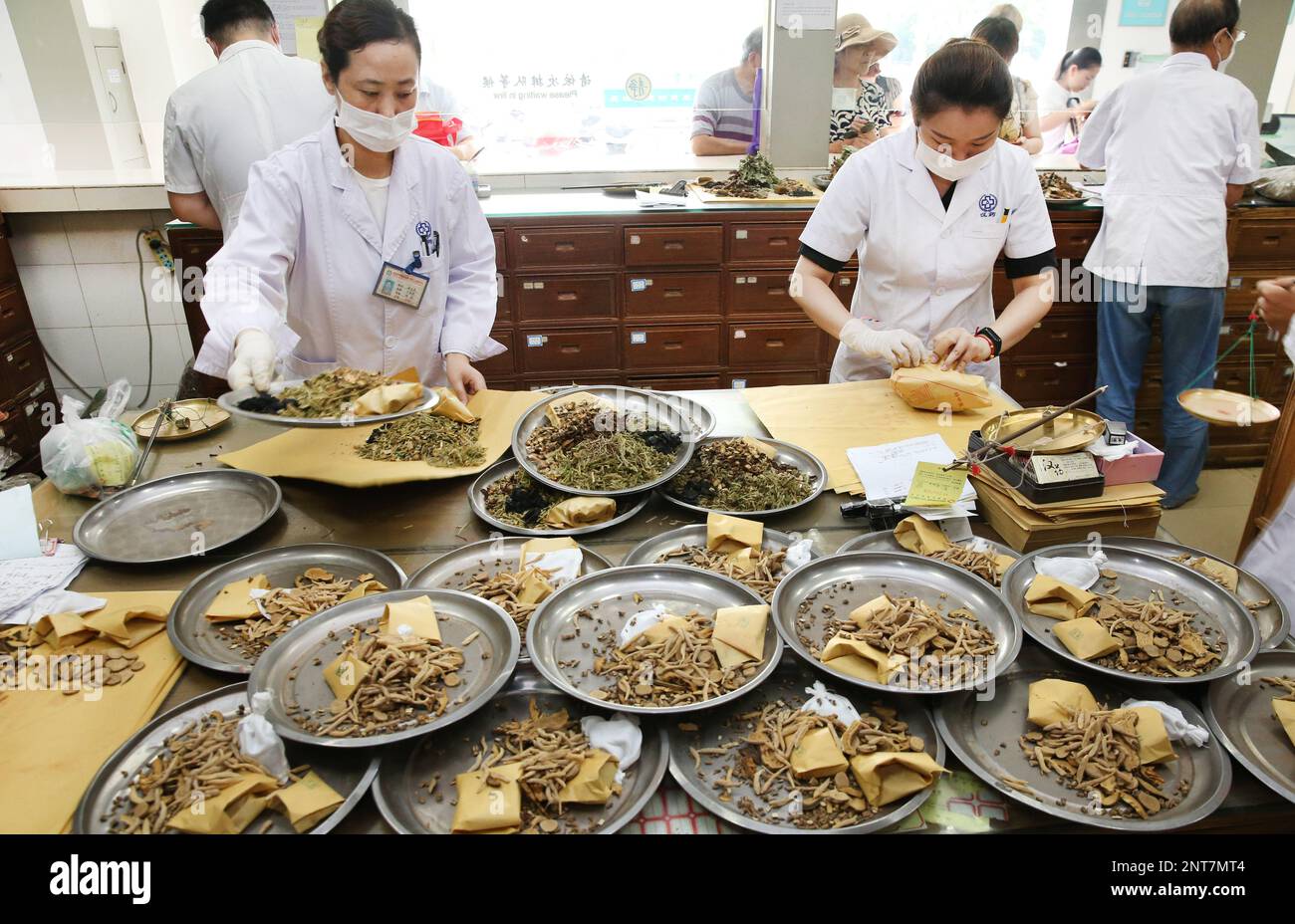 Chinese medicine dispenser are dispensing traditional Chineses ...