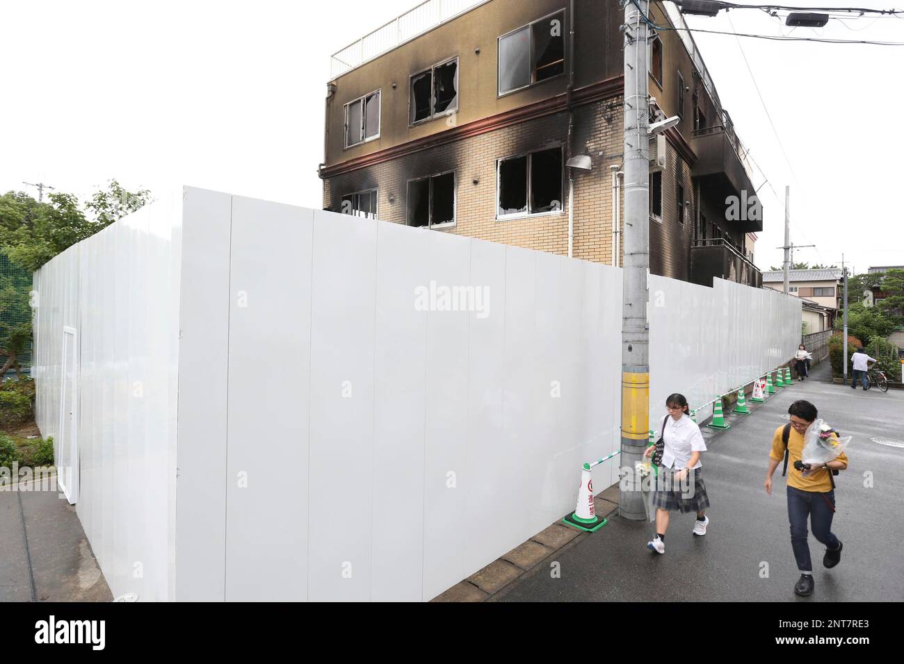 A photo shows the white walled arson site of Kyoto Animation Co., Ltd ...