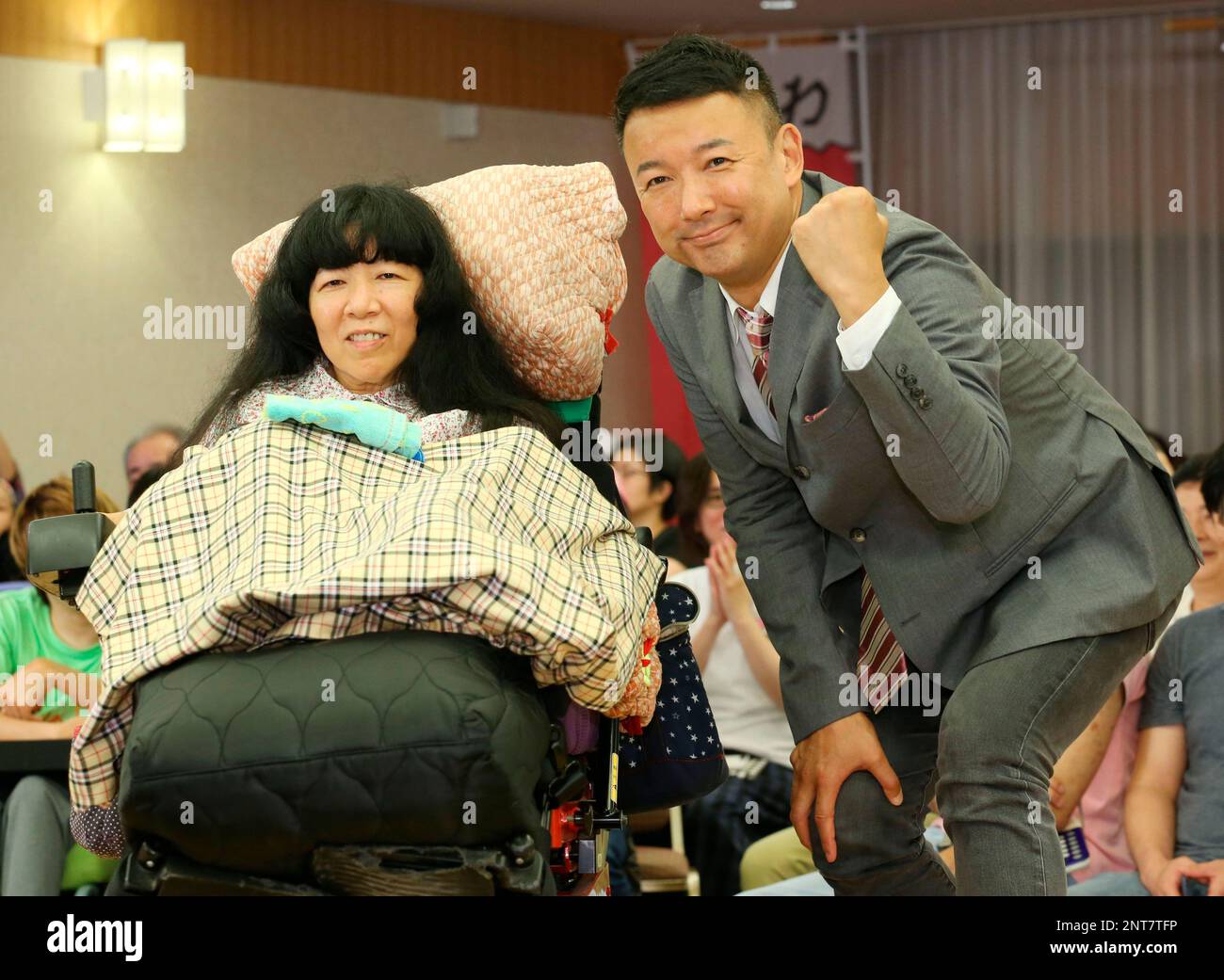 Reiwa Shinsengumi leader Taro Yamamoto (R) and 54-year-old Eiko Kimura pose for photo after the ...
