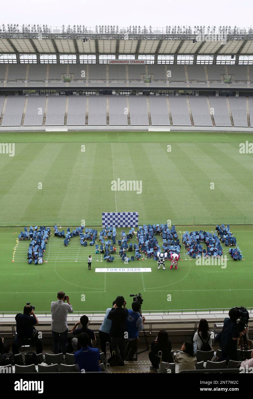 About 400 children and their parents made word "1 Year to Go!" during ...