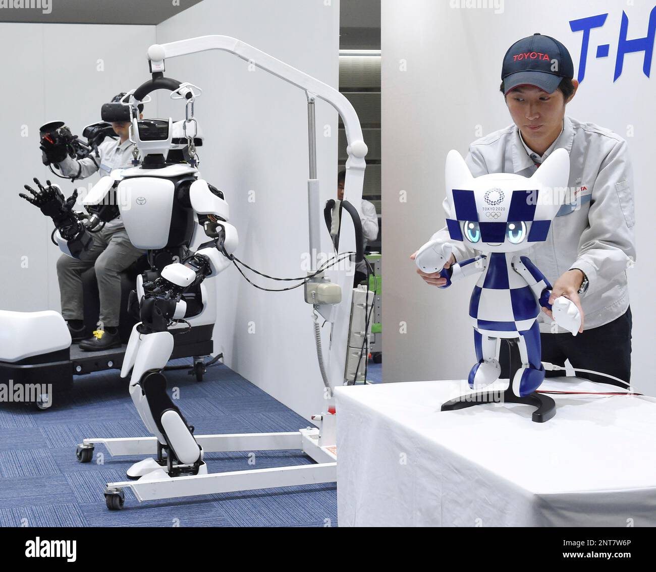 A photo shows a robot "Tokyo 2020 Mascot Robot Miraitowa" (R) and a ...