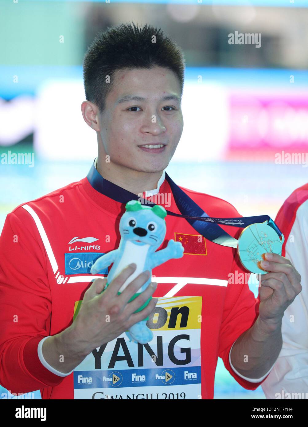 YANG Jian, a winner of Men's 10M Platform, poses for photo in 18th FINA ...