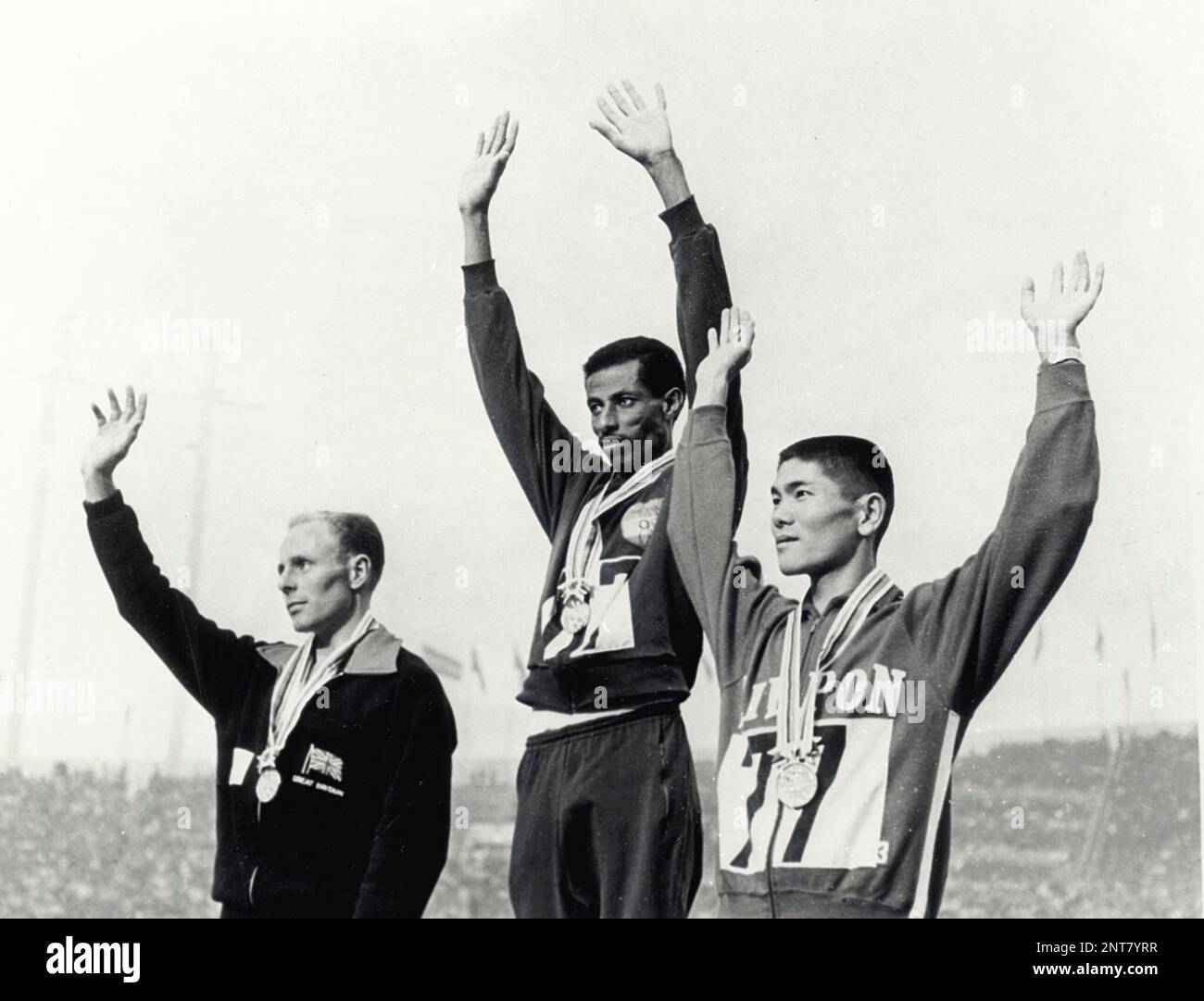 (L to R) Basil Heatley of Great Britain, silver, Abebe Bikila of ...
