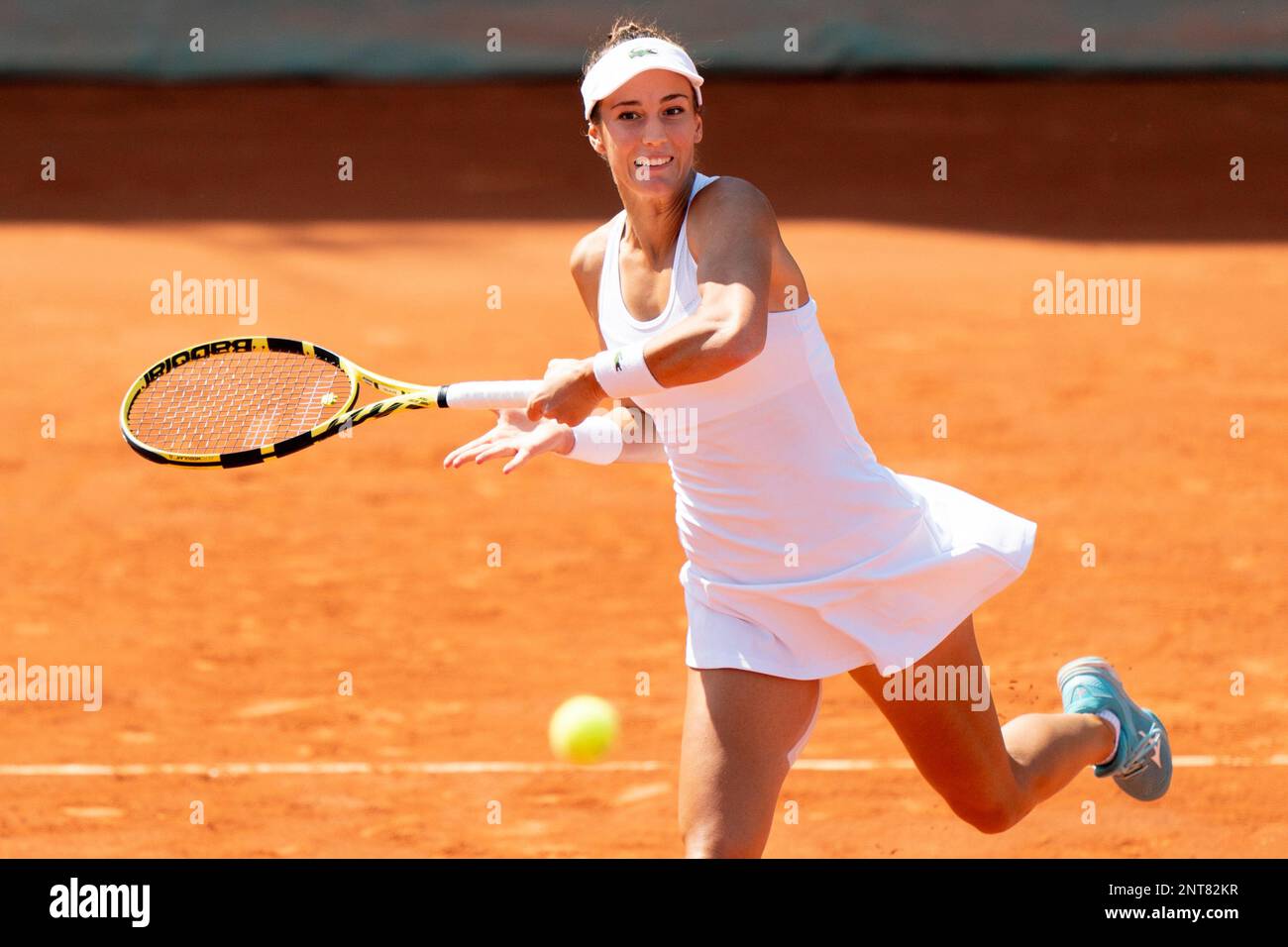 Bernarda Pera from USA returns the ball during the semi final match ...