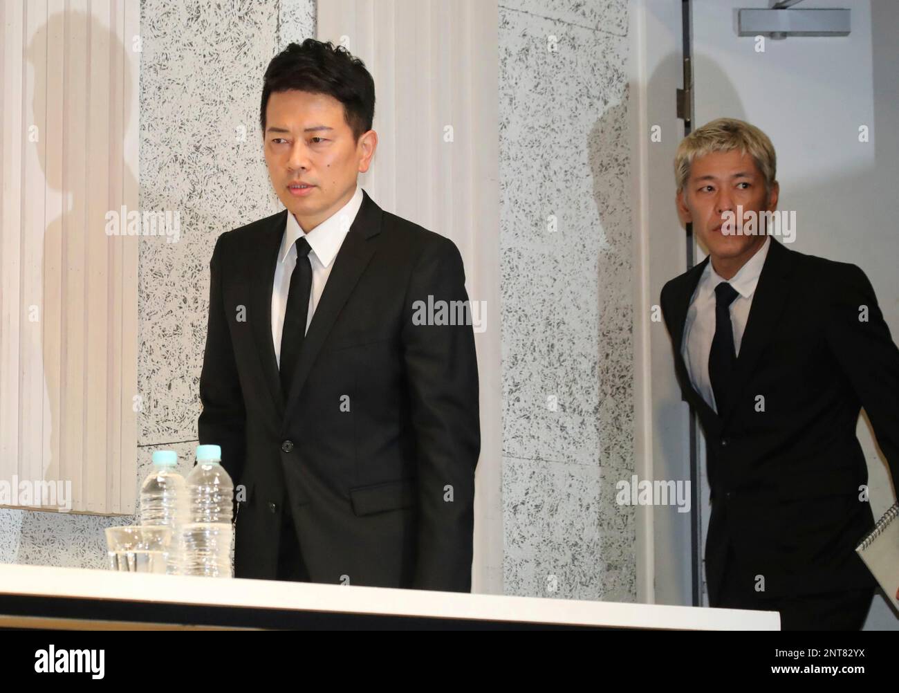 Japanese comedian Miyasako (L) accompanied by Ryo Tamura attends a ...