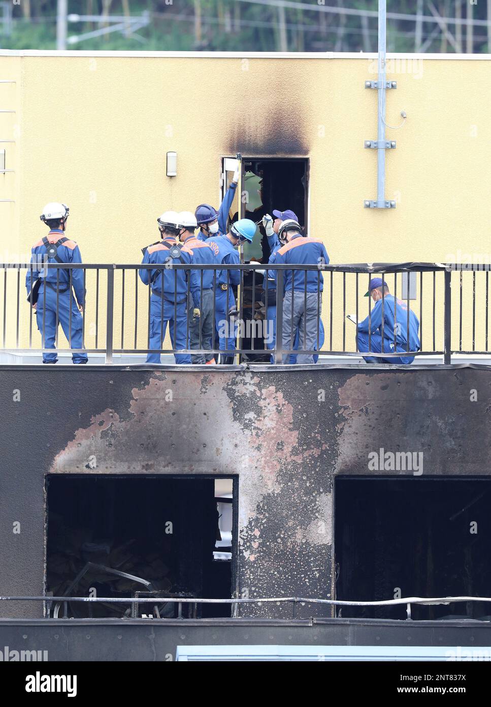 Officers conduct an investigation at the arson site of Kyoto Animation ...