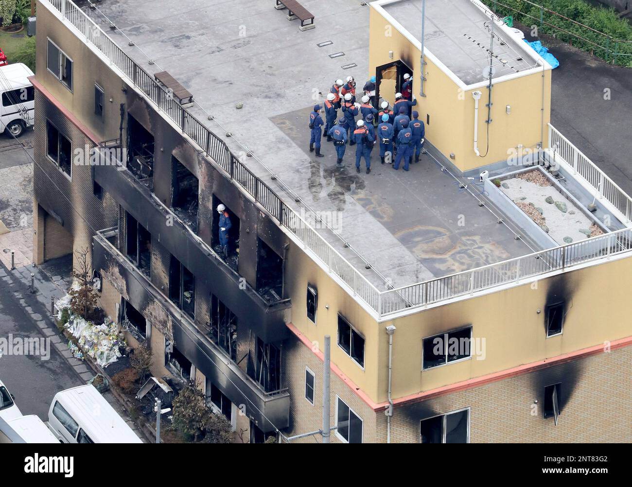 An aerial photo shows officials conduct an investigation at the arson ...